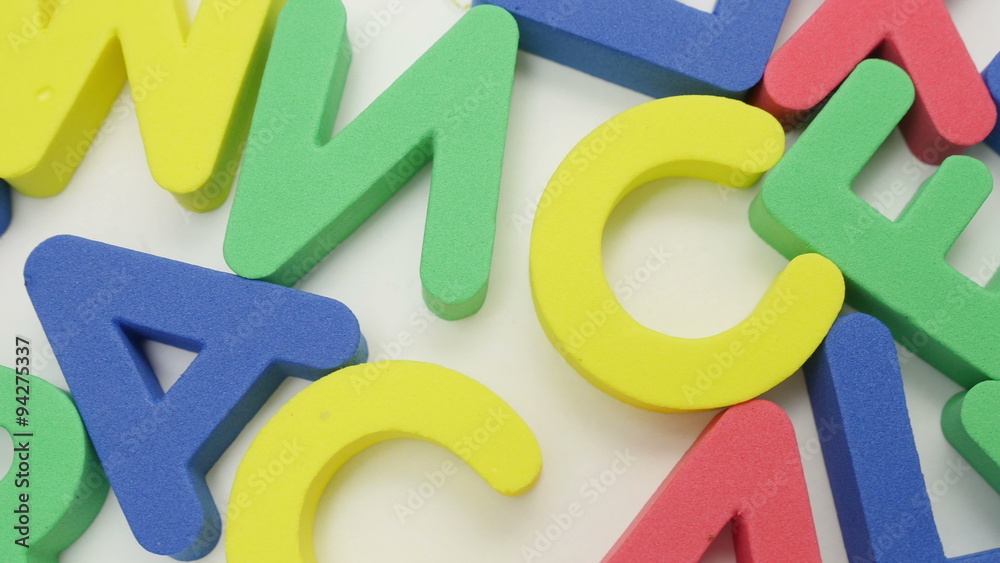 Alphabet background with mixed colorful letters. Slowly turn. 4K UHD ...