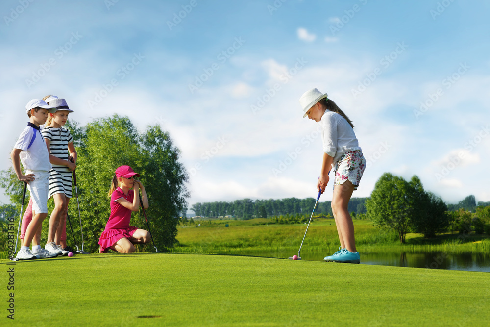 Kids playing golf Stock Photo | Adobe Stock