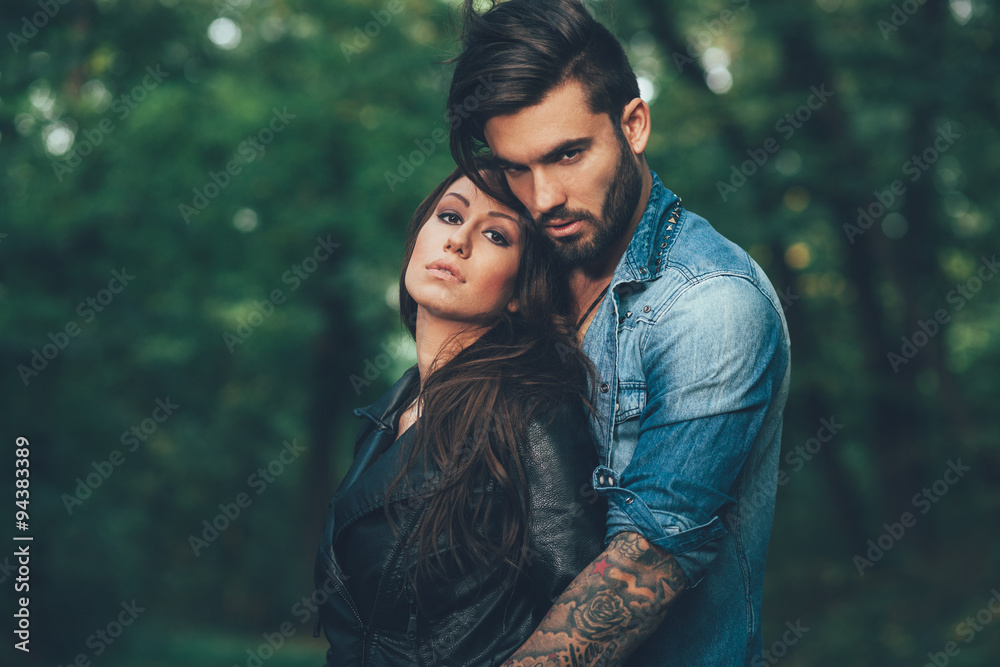 Young couple hugging in the park Stock Photo | Adobe Stock