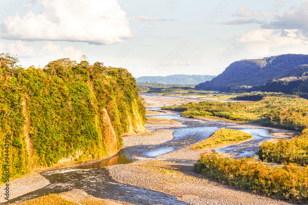 A stunning Ecuadorian landscape with a winding river cutting through ...