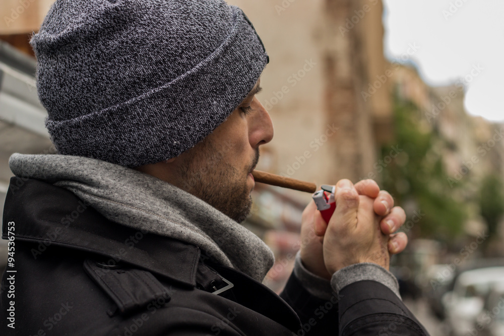 Handsome guy in the street. / Handsome guy smoking on the street while ...