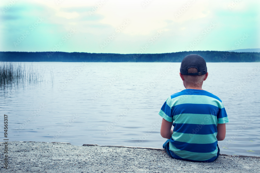 sad child sitting alone Stock Photo | Adobe Stock