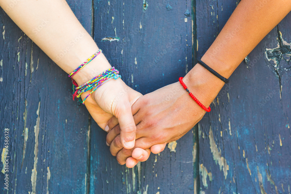 Two women holding hands Stock Photo | Adobe Stock