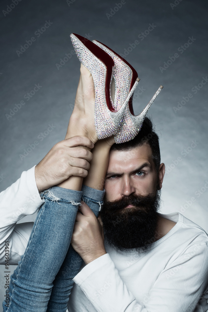 Man holding legs of woman Stock Photo | Adobe Stock