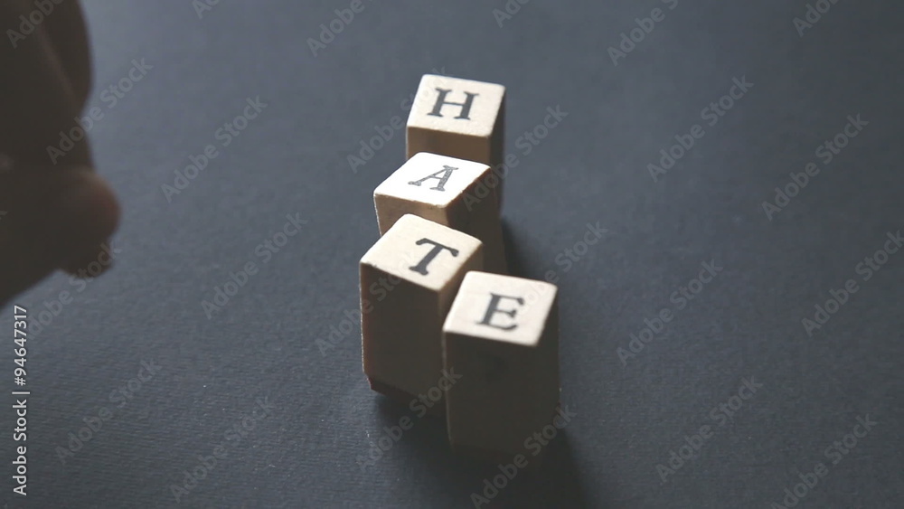 playing and typing the word "hate" with alphabet stamps Stock Video ...