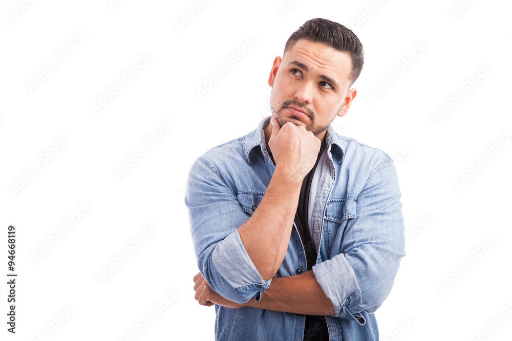 Handsome young man thinking Stock Photo | Adobe Stock