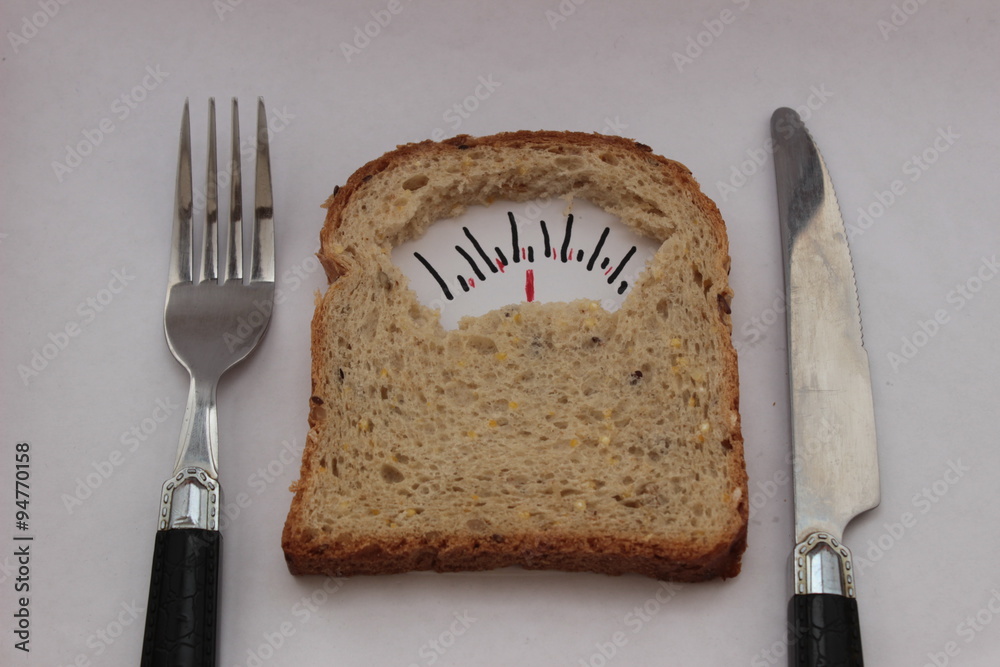 Wholesome slice of bread as weighing scale. whole bread look like a ...