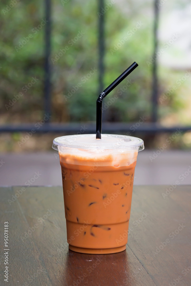 Refreshment and take away Iced Milk Tea with straw in plastic cup Stock ...