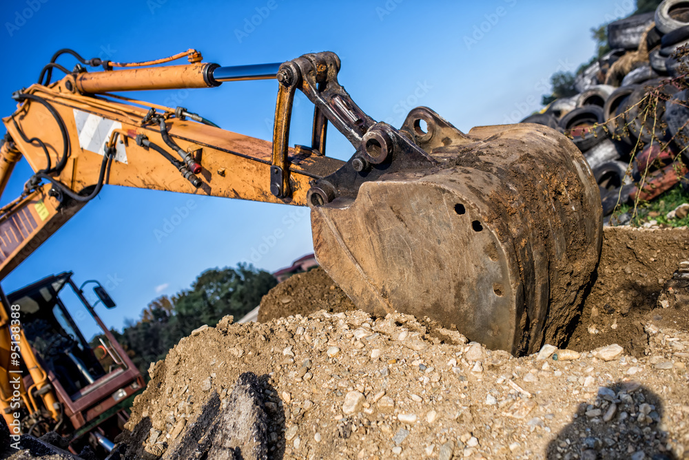 demolishing operations at industrial construction site. worker using ...