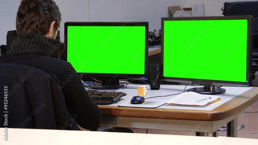 Office worker with greenscreen computers - 1080p. Worker in his office ...