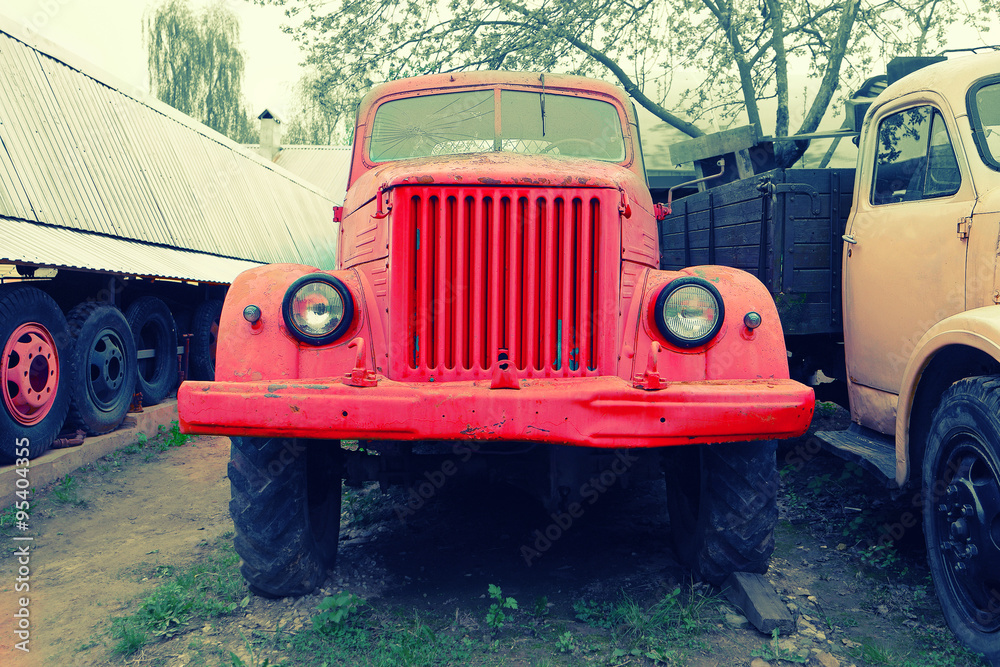 Old rusty red farm trucks fading in time frontview. Stock Photo | Adobe ...