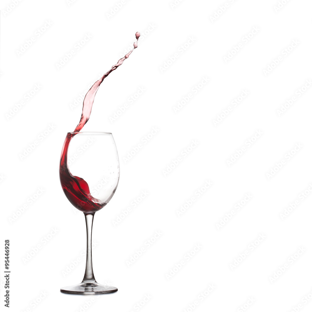 wine glass splash. Pouring natural red grape liquid into glass, close ...