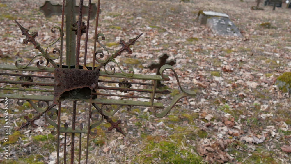 Unique design of a cross in the cemetery. Looks like a guitar string ...