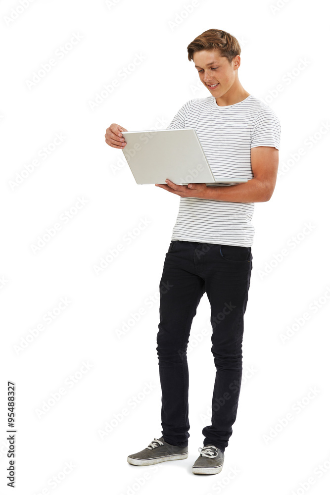 Full Length Studio Shot Of Teenage Boy Using Laptop Stock Photo | Adobe ...