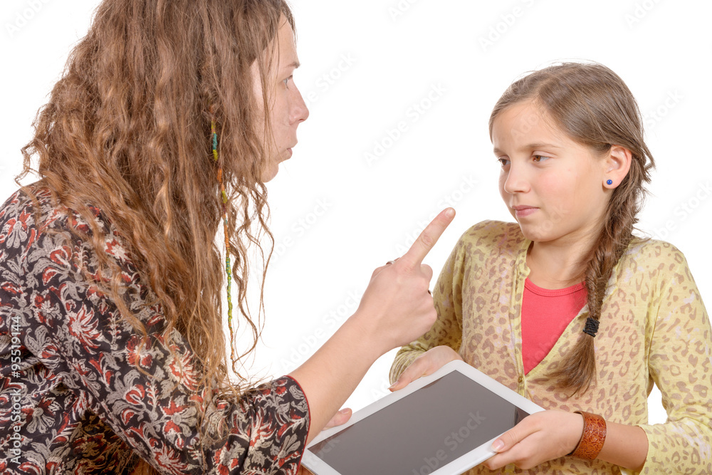 Angry mother scolding daughter because she palaying with a digital ...