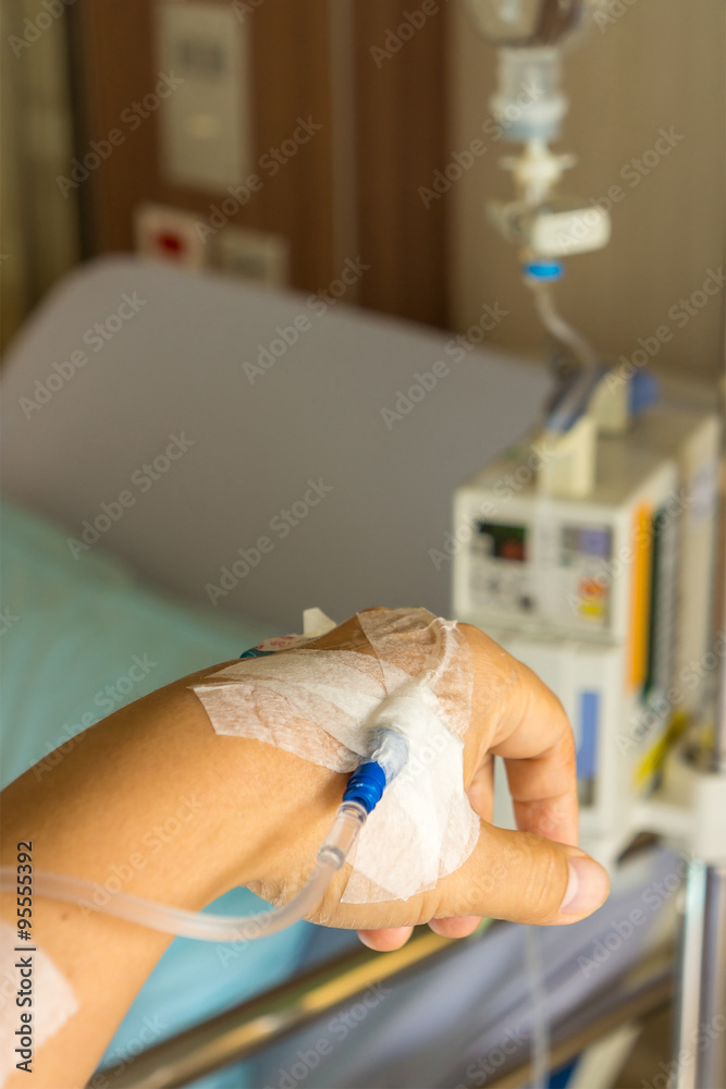 Patient with an intravenous line. It is inserted into a vein in the ...