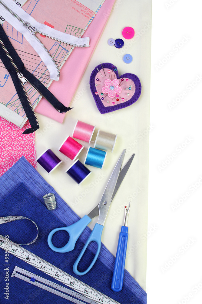 Selected sewing tools and materials, arranged as a border. Pure white ...