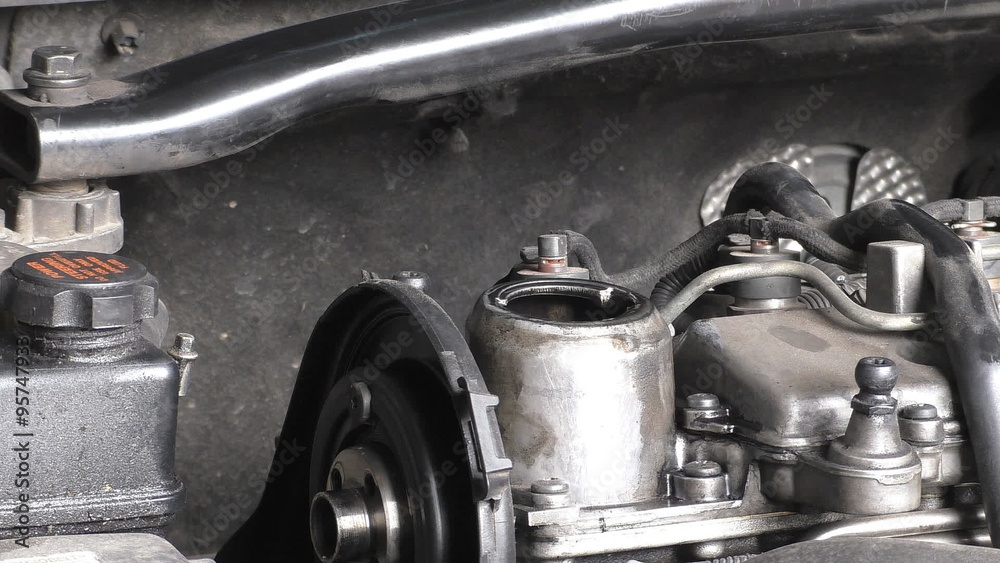 Removing diesel engine fuel injector return line clips Stock Video ...