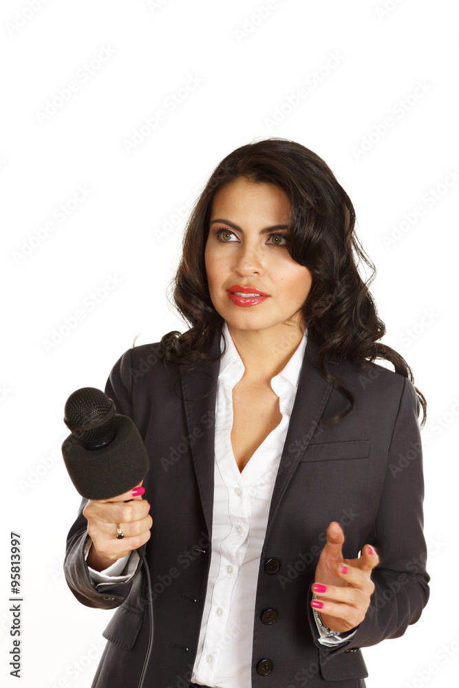 Young woman holding microphone as if interviewing somone "out of frame ...