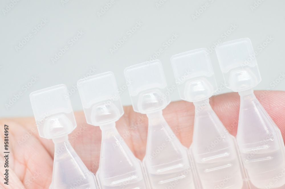 Artificial tear single use containers eye drop on hand Stock Photo ...