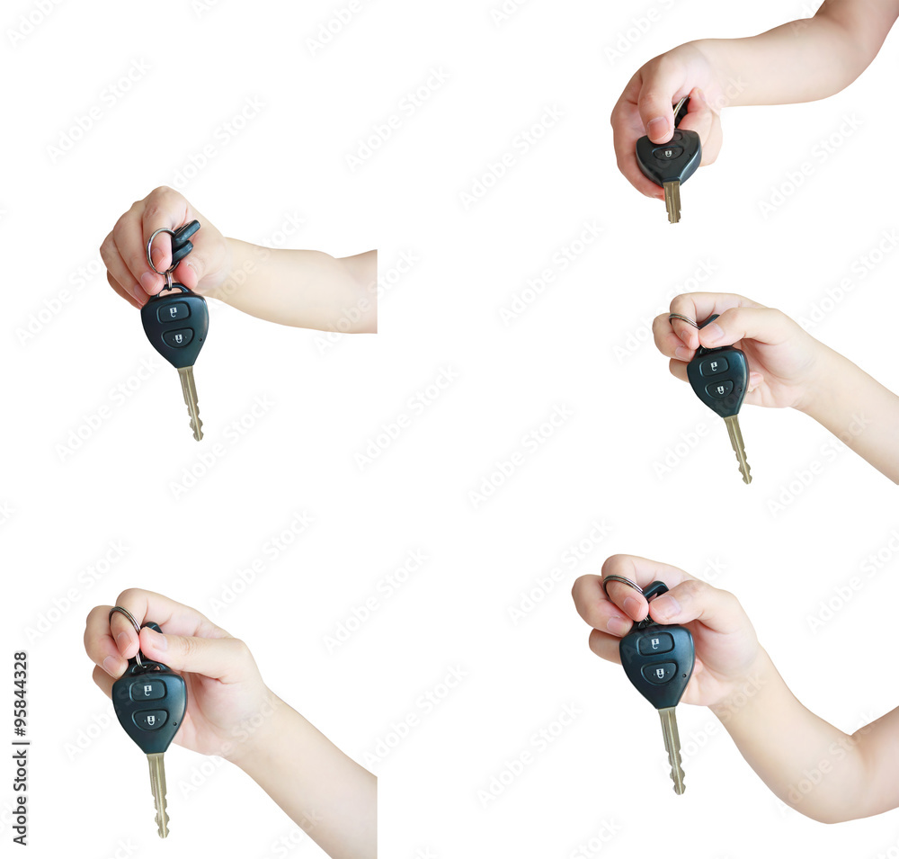 Hand holding car key isolated on white background Stock Photo | Adobe Stock