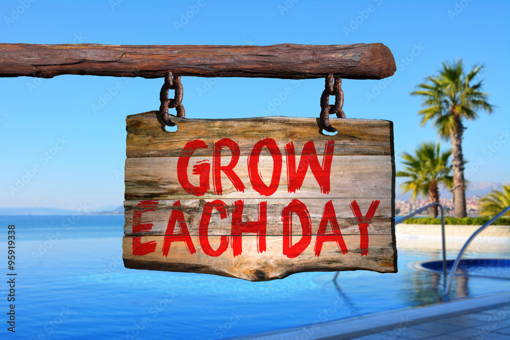 Grow each day motivational phrase sign Stock Photo | Adobe Stock