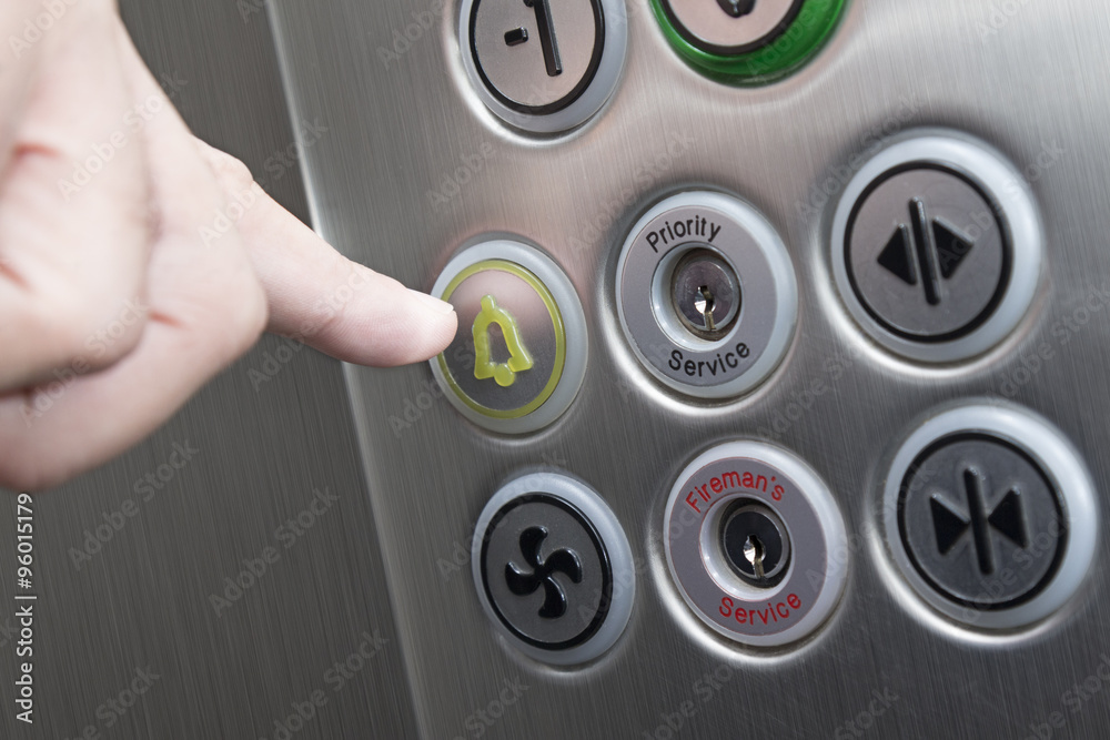 Forefinger pressing the alarm button in the elevator Stock Photo ...