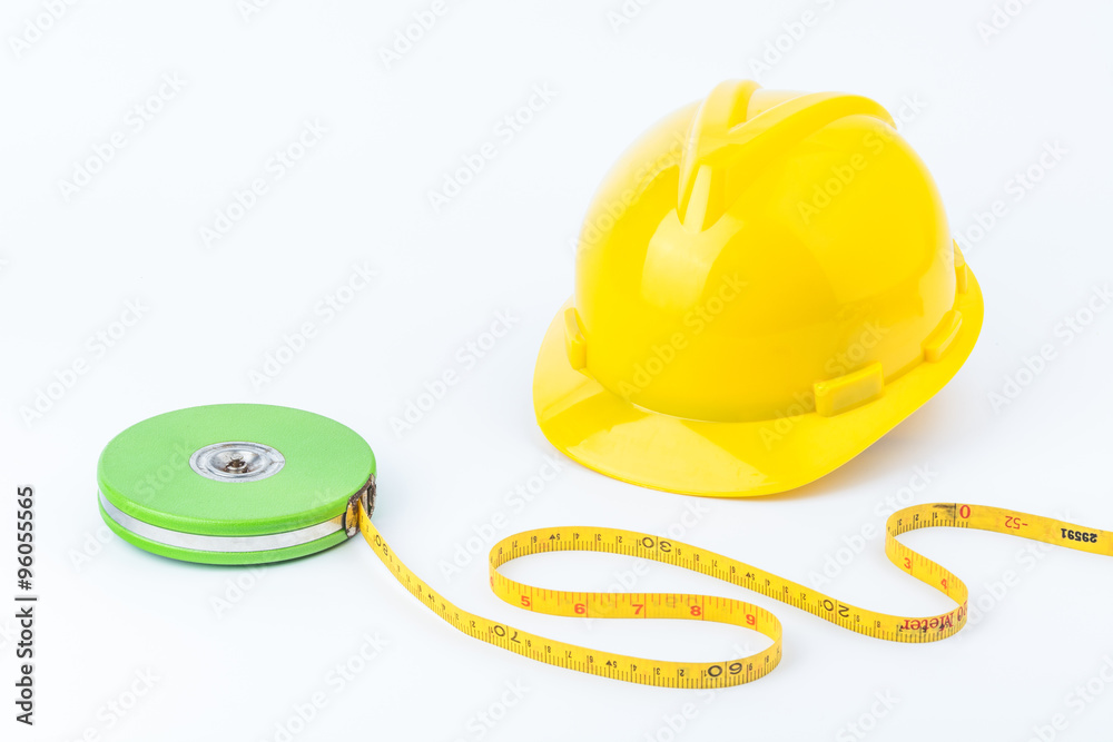 Yellow safety helmet and Green measuring tape Stock Photo | Adobe Stock