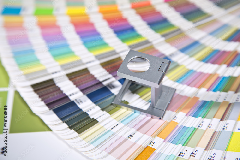 Pantone color palette and magnifying glass Stock Photo | Adobe Stock