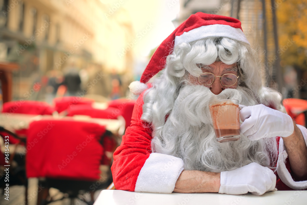 Santa Claus drinking a hot chocolate Stock Photo | Adobe Stock