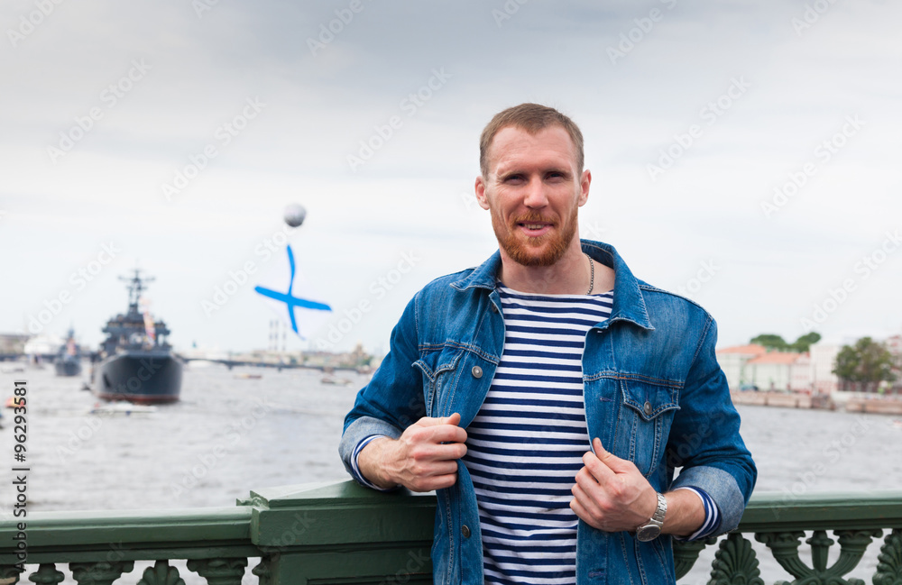 man in sailor suit on ship background. Stock Photo | Adobe Stock