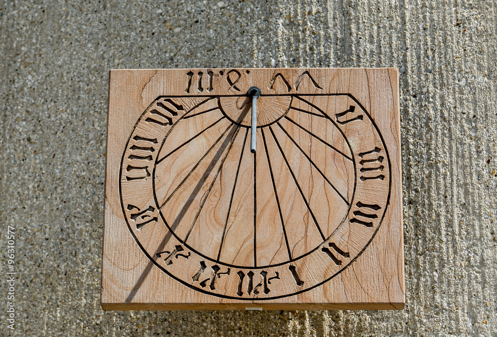 Antique wooden sundial showing time with shadow Stock Photo | Adobe Stock