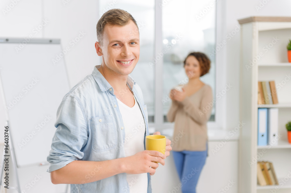 Two colleagues on coffee break at the office. Stock Photo | Adobe Stock