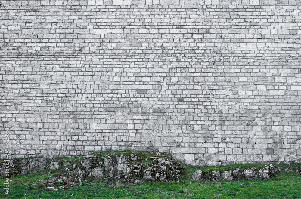 Foto de Part of castle wall made of limestone bricks built on white ...