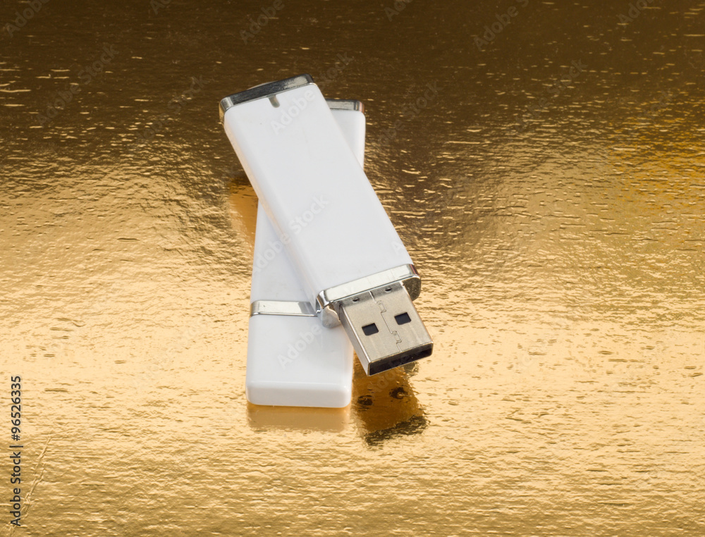 usb memory stick drives gold background Stock Photo | Adobe Stock