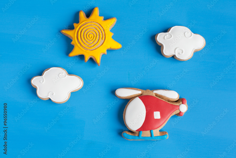 Homemade gingerbread cookies in the shape of helicopter and clouds ...