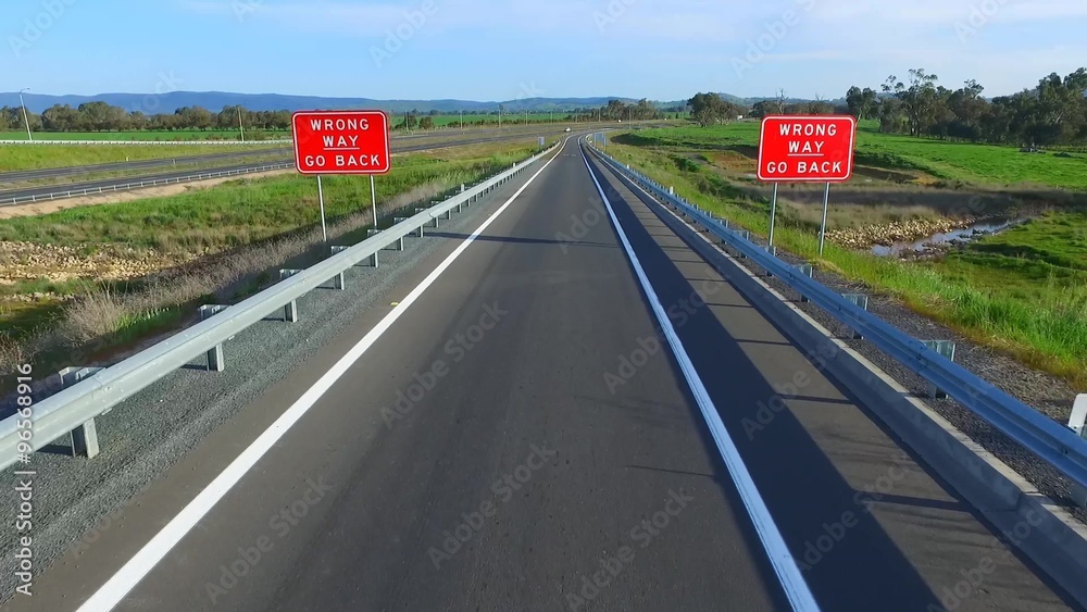 Wrong way go back road signage on major high speed highway (freeway ...