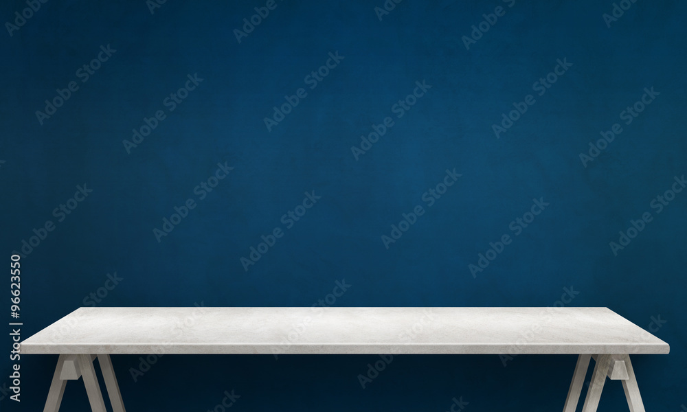 Modern white table with legs and free space. Blue wall texture in ...