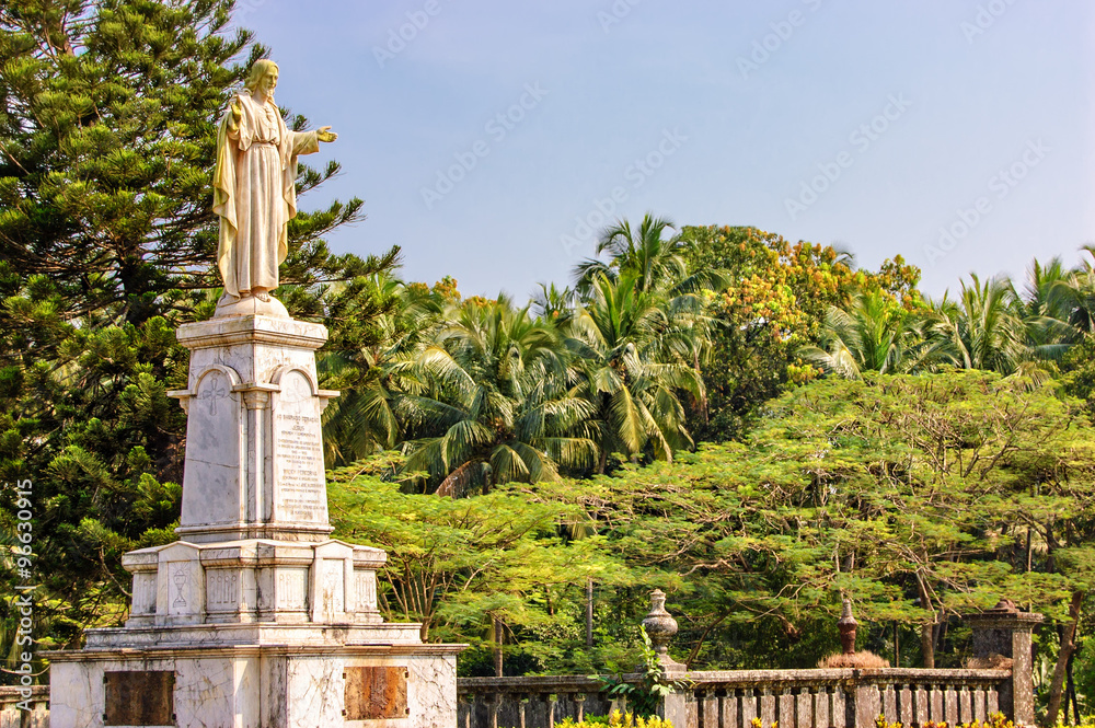 Poster Statue of Jesus in Se Cathedral church around palm trees in ...