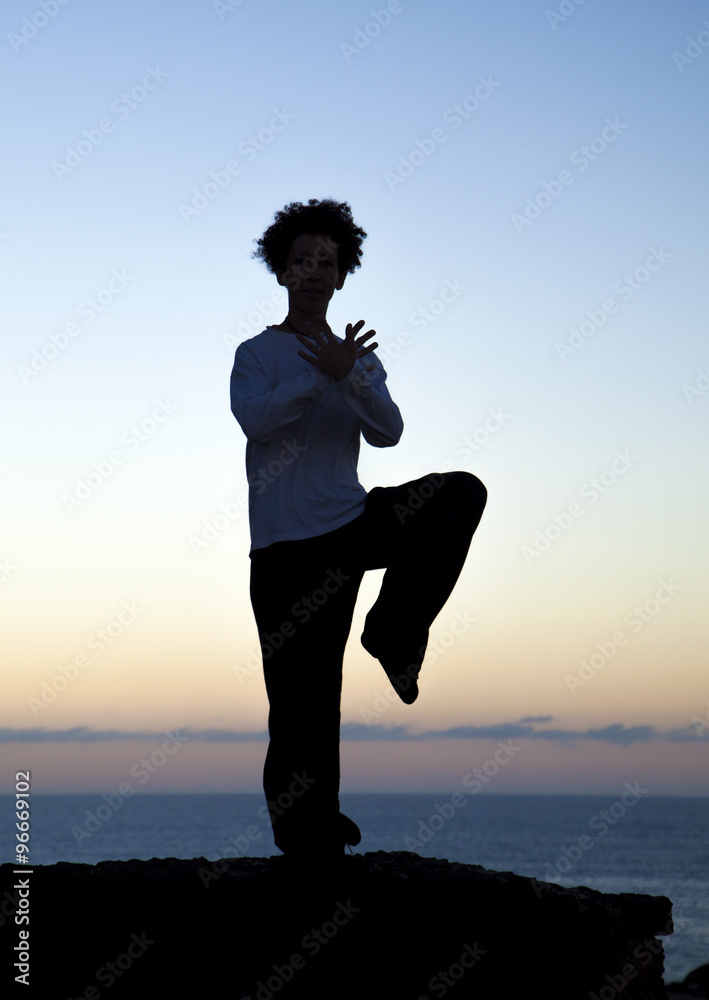 Tai chi at sunset Stock-Foto | Adobe Stock
