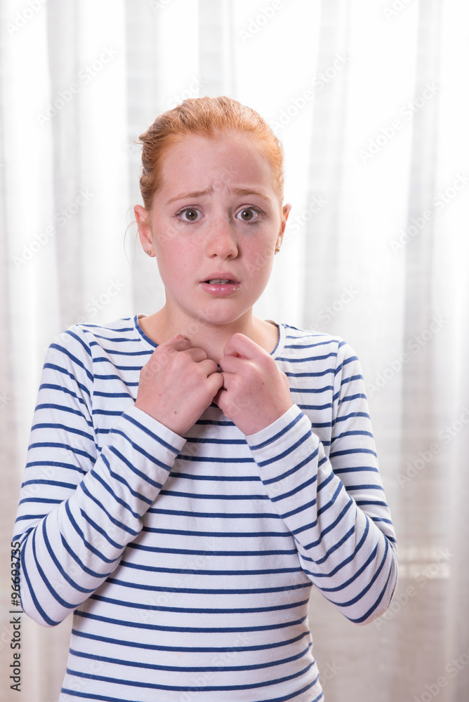 Portrait crying teenage girl looking into camera Stock Photo | Adobe Stock