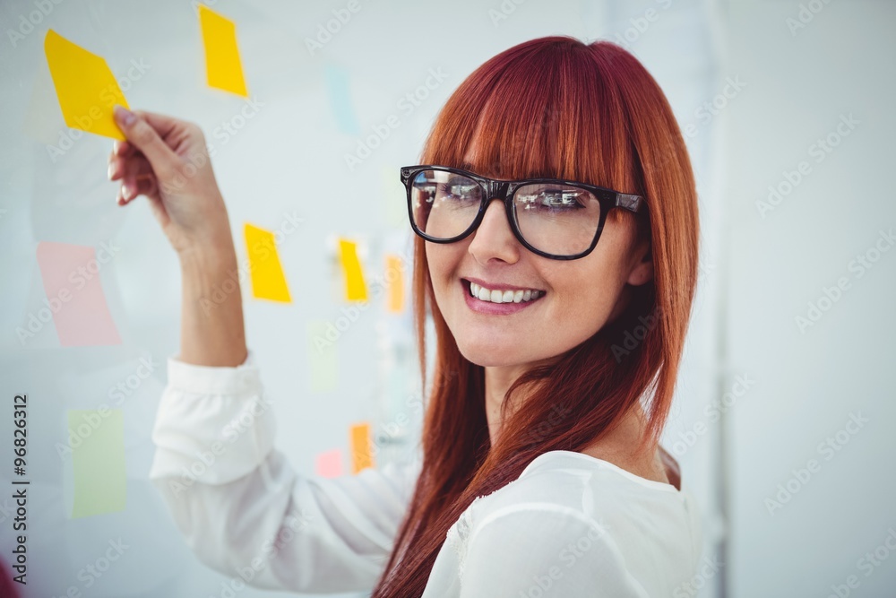 Attractive hipster woman holding sticky notes Stock Photo | Adobe Stock
