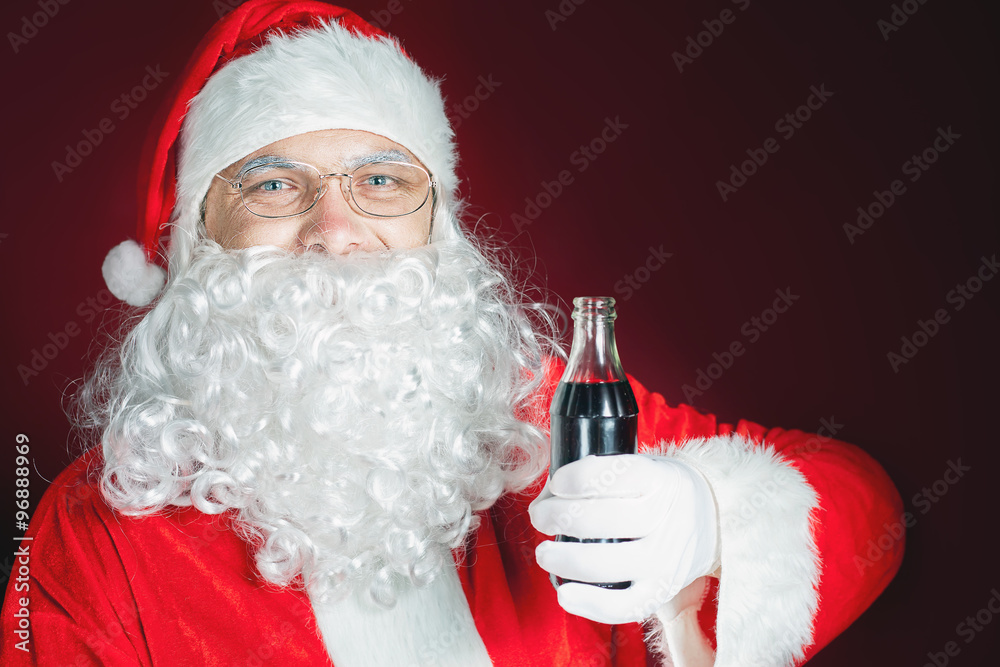 Santa Claus holding Coca Cola fresh beverage, Christmas holiday Stock ...