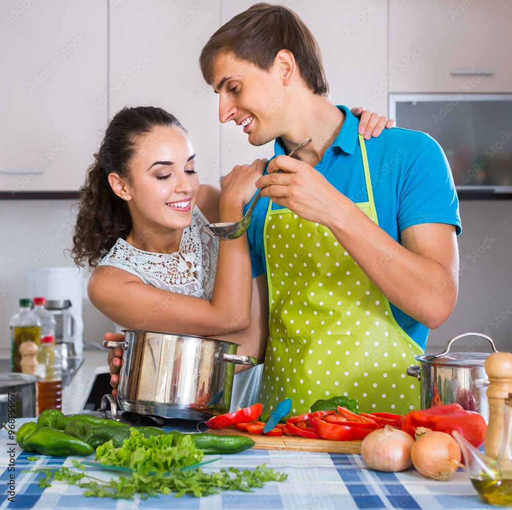Young couple cooking healthy dinner Stock Photo | Adobe Stock