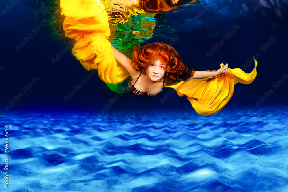 Beautiful Red Haired Girl Swimming Under Water In The Sea Lady In