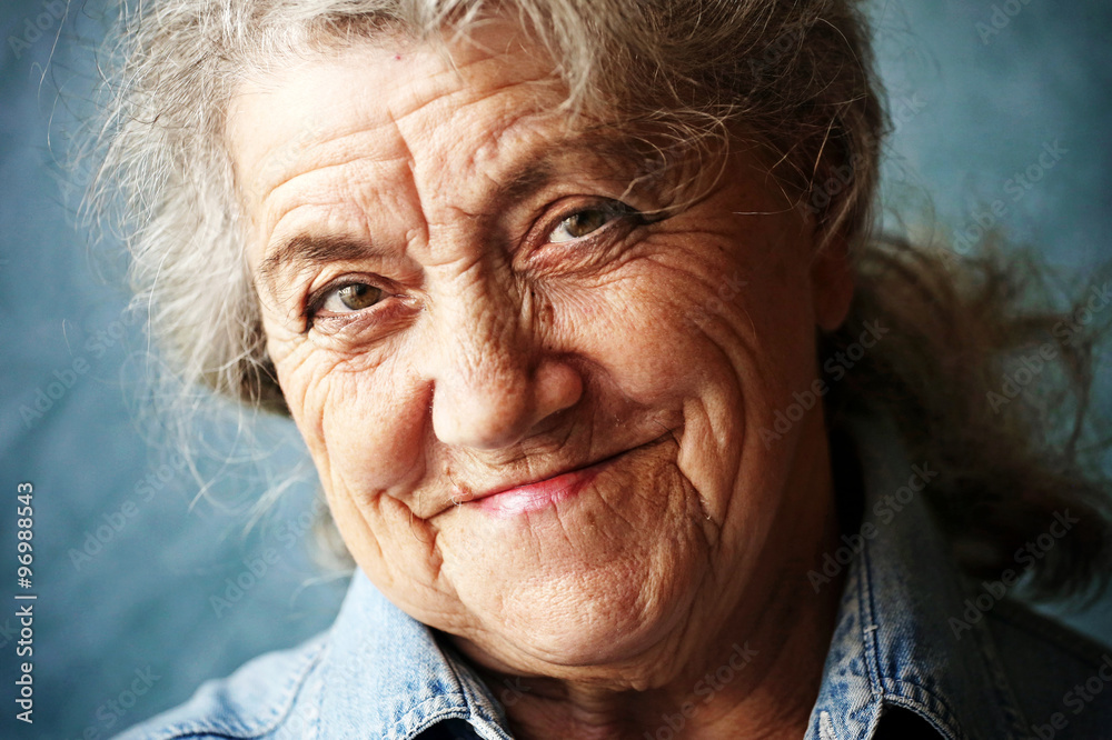Happy granny face on a blue background Stock Photo | Adobe Stock