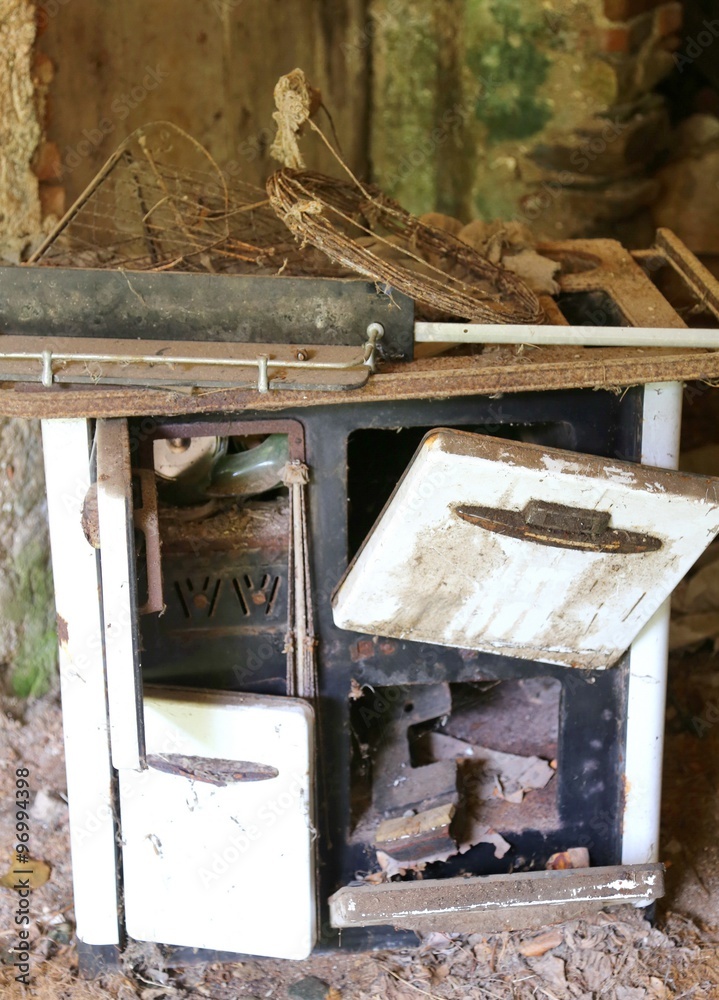 rusty wood-burning stove in an old abandoned destroyed house Stock ...