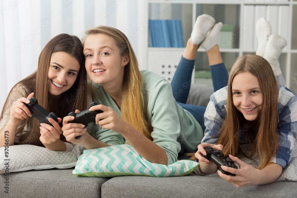 Teenage friends playing together Stock Photo | Adobe Stock