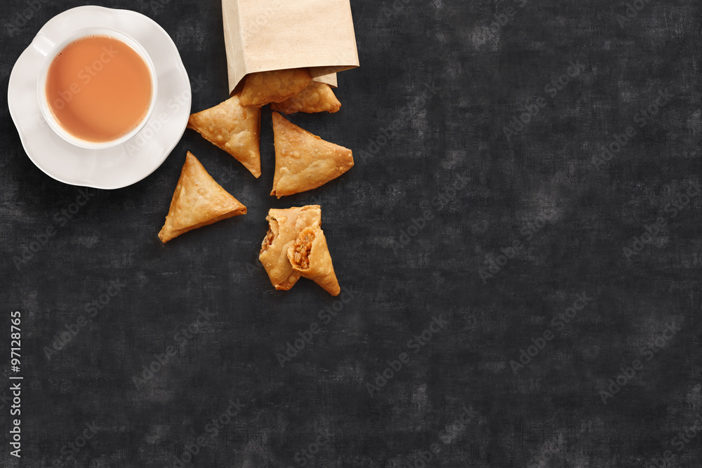 Tea/chai served along with crisp samosas, a local snack Stock Photo ...