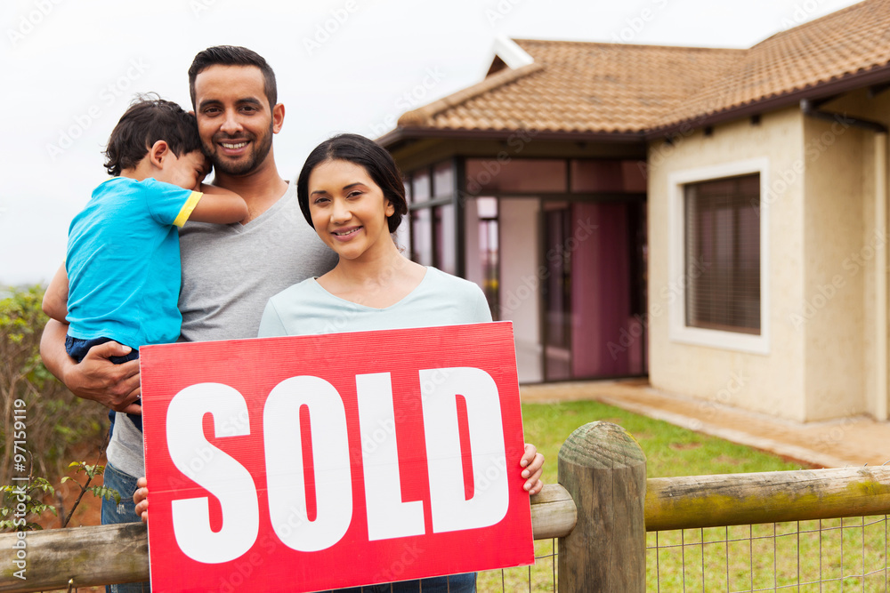 indian family holding sold sign Stock Photo | Adobe Stock